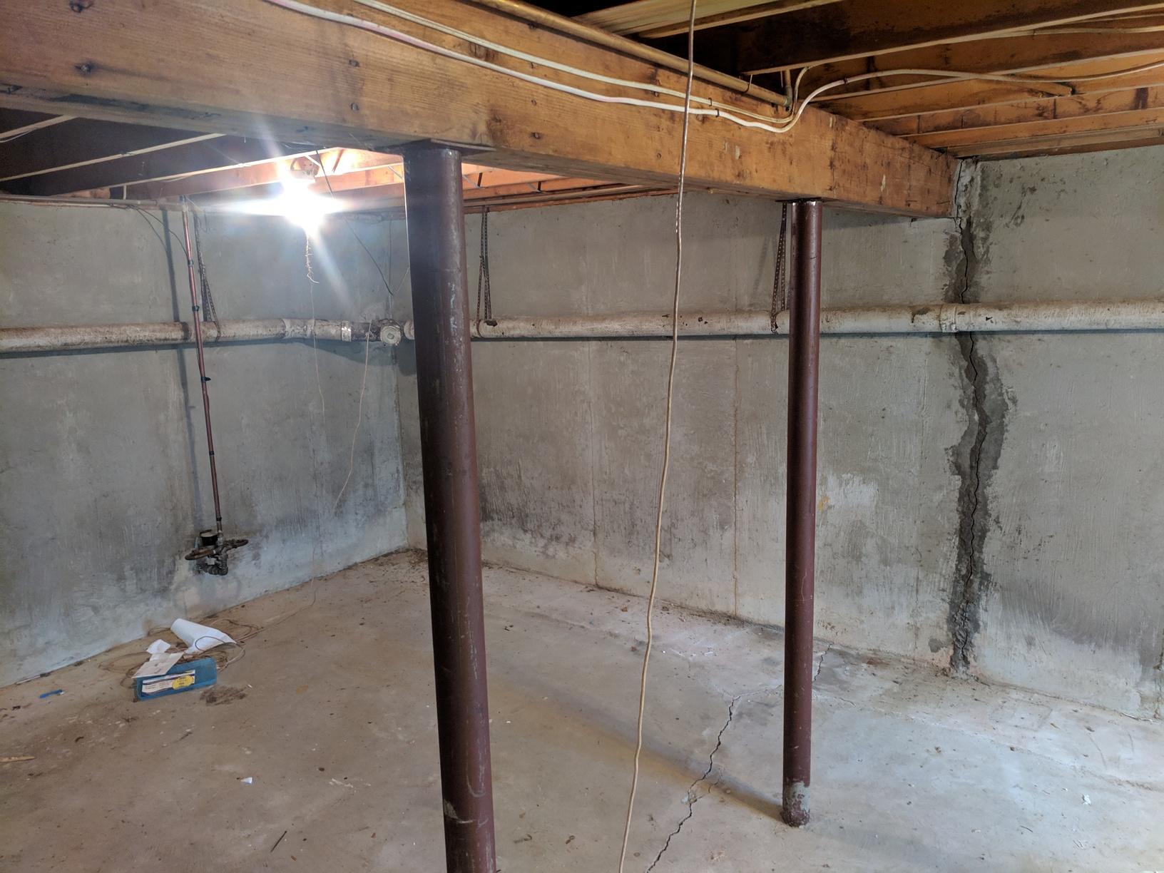 Settling Foundation on Hill, Nashua, NH - Sagging Beam and Crack