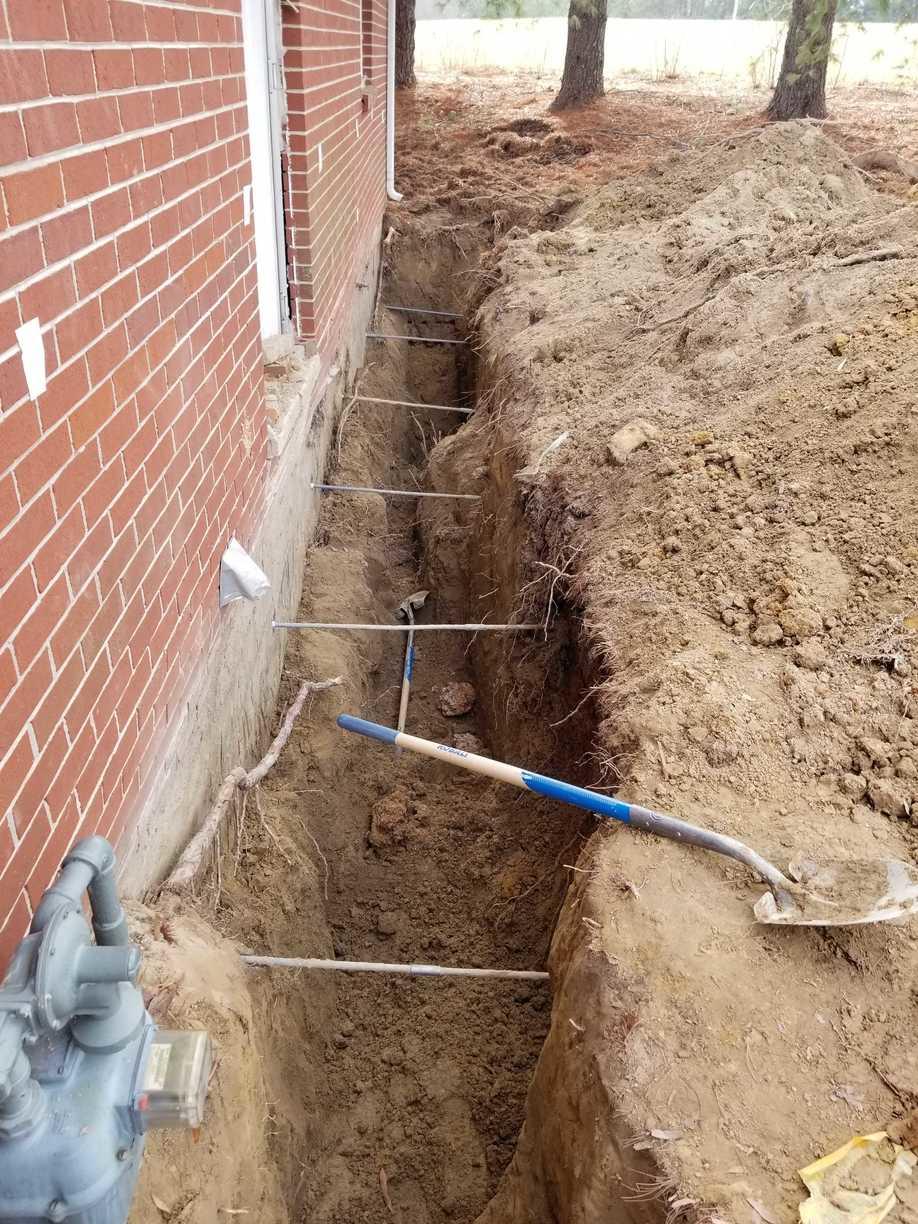 Foundation Repair - Wall Support in Pine Hall, NC - Digging Trench to ...